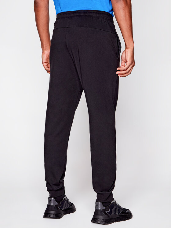 adidas Spodnie dresowe Essential FM4346 Czarny Regular Fit | Modivo.pl
