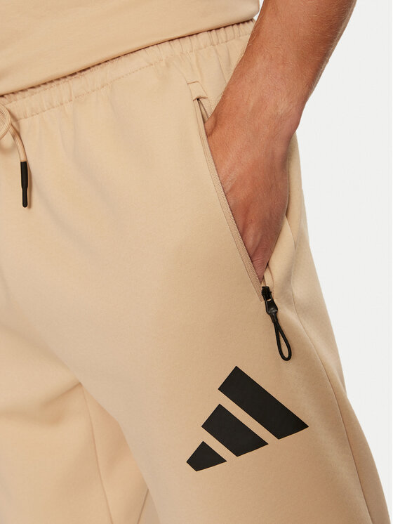 adidas Spodnie dresowe Z.N.E. JE7539 Beżowy Regular Fit | Modivo.pl