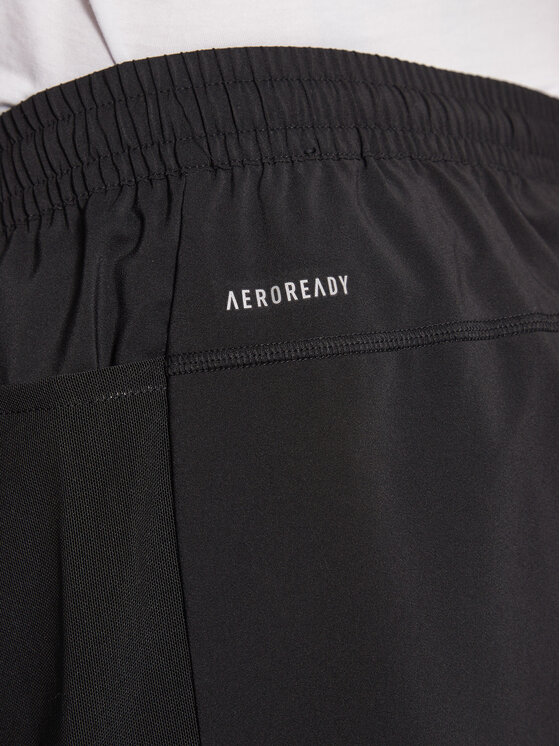 adidas Spodnie dresowe Own the Run HR6611 Czarny Regular Fit | Modivo.pl