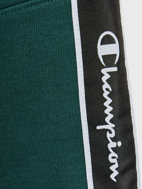 Champion Sportinis kostiumas 306181 Žalia Regular Fit | Modivo.lt