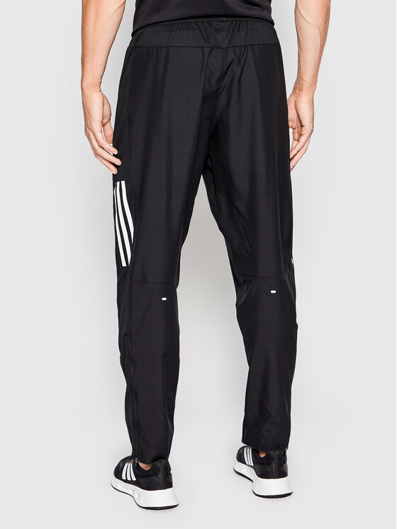 adidas Spodnie dresowe Own The Run Astro Wind H13238 Czarny Regular Fit ...